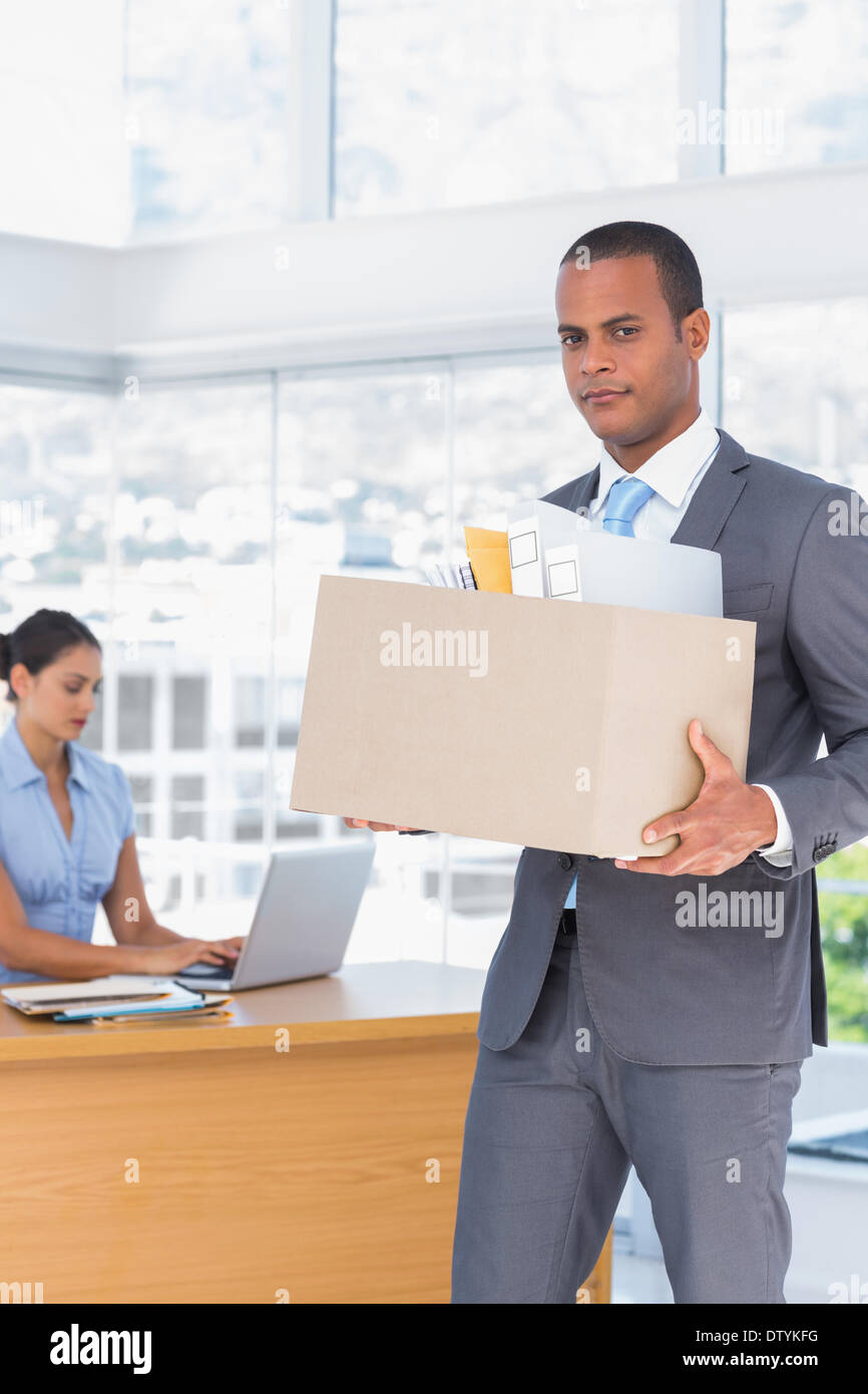 Upset businessman leaving the company Stock Photo - Alamy