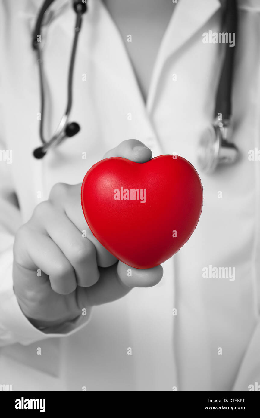 Heart in a doctor's hand Stock Photo - Alamy