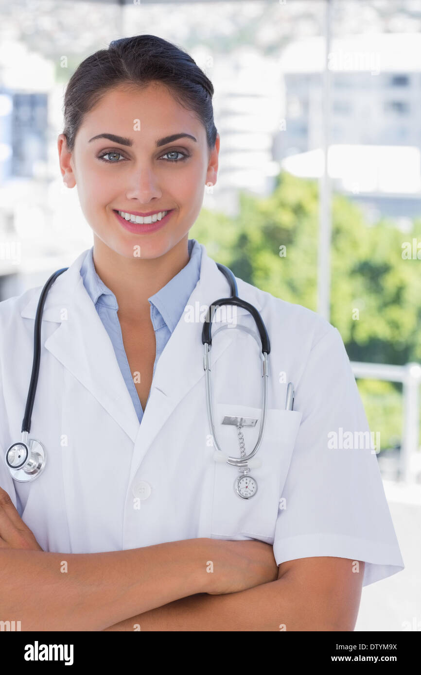 Young doctor with arms crossed Stock Photo - Alamy