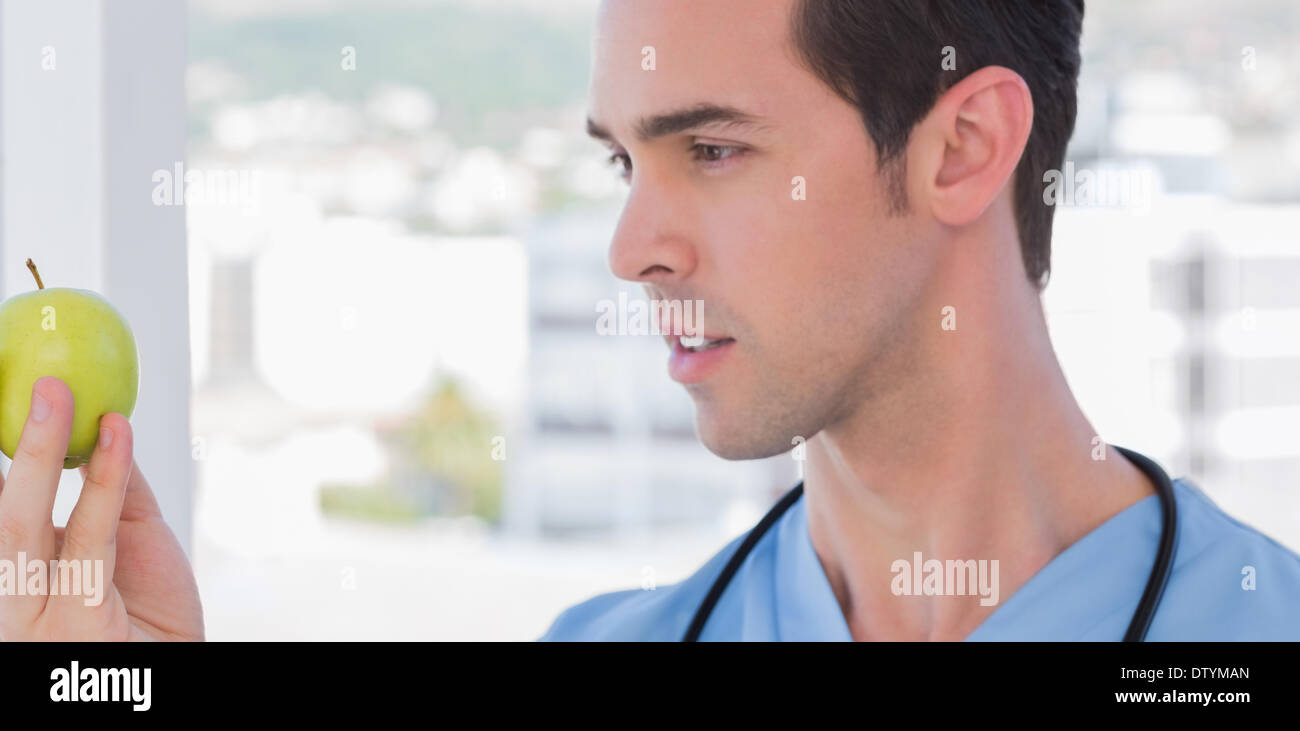 Cheerful handsome practitioner standing hi-res stock photography and ...