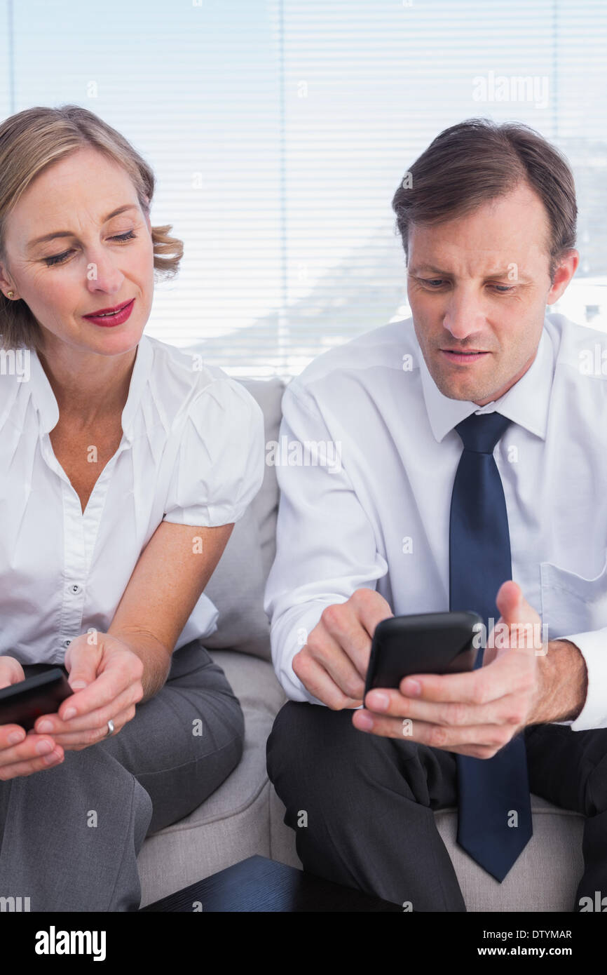 Happy blonde businessman using phone hi-res stock photography and ...