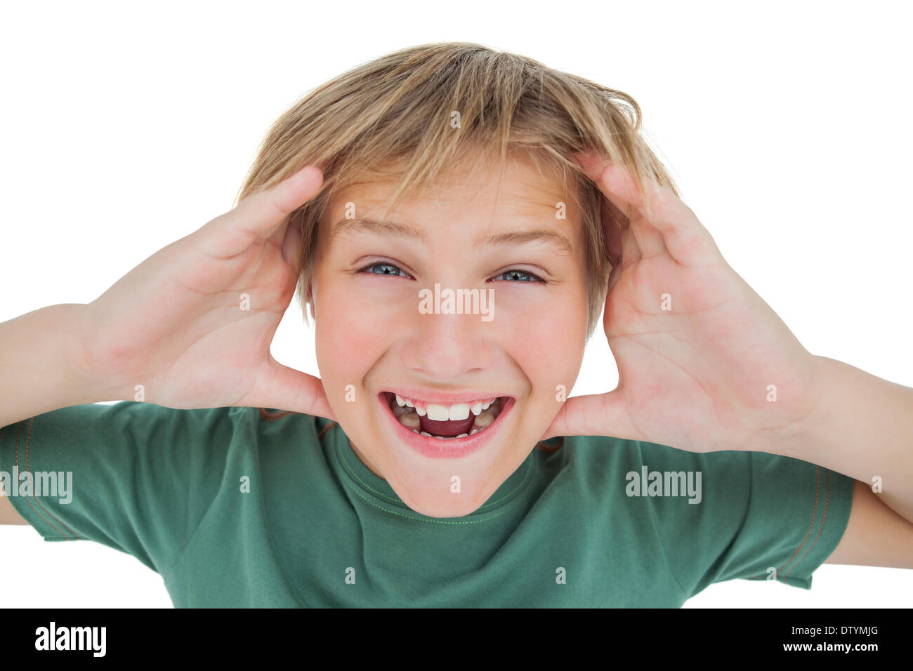 Amazed boy smiling with hands raised Stock Photo - Alamy