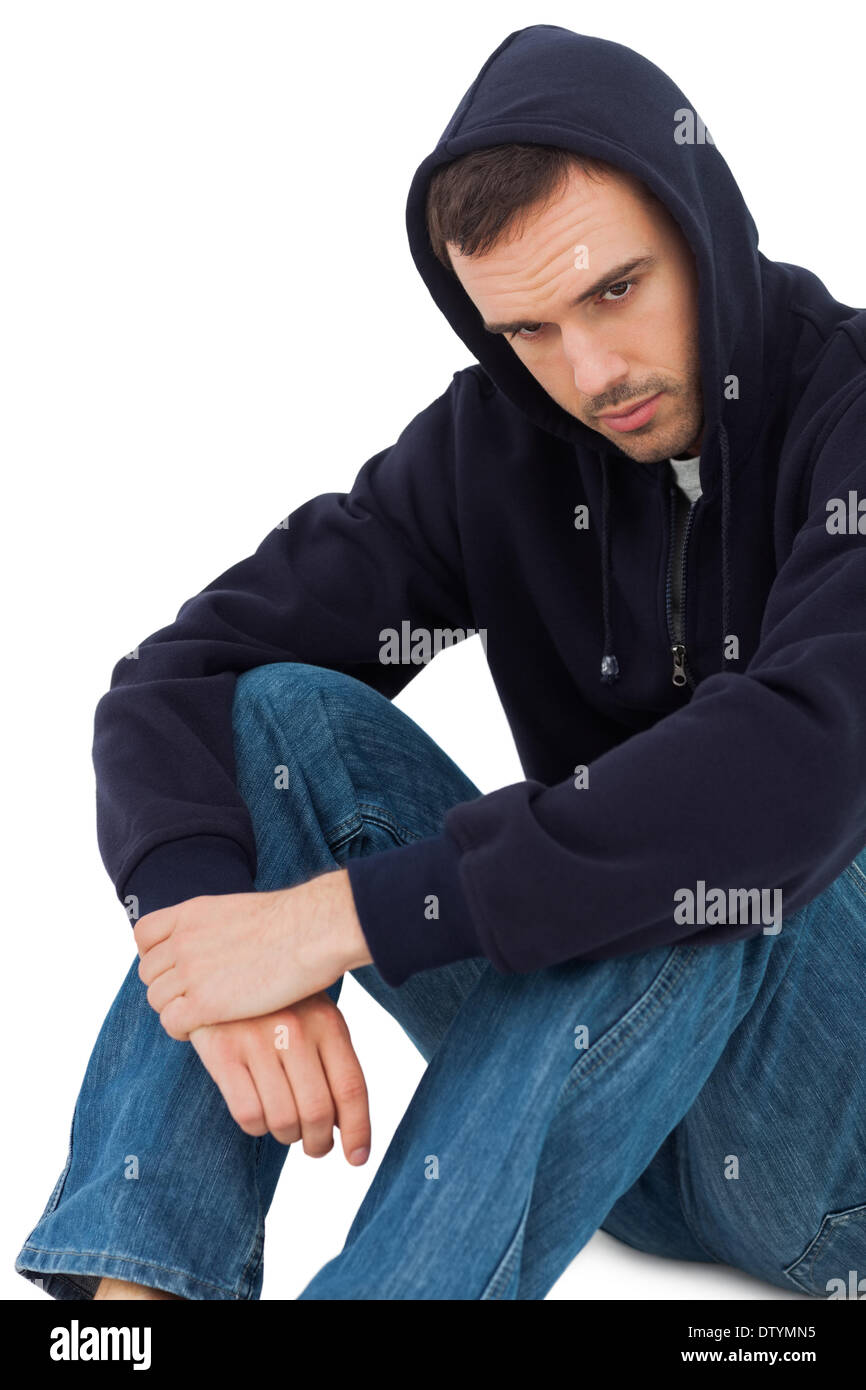 Portrait of a sad man sitting Stock Photo - Alamy