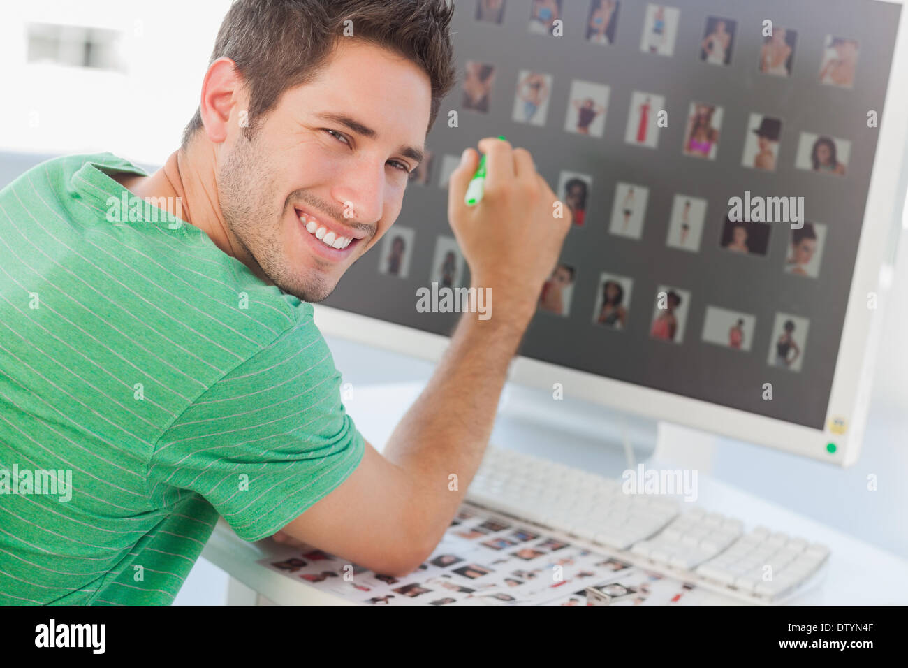 Photo female pointing monitor hi-res stock photography and images - Alamy