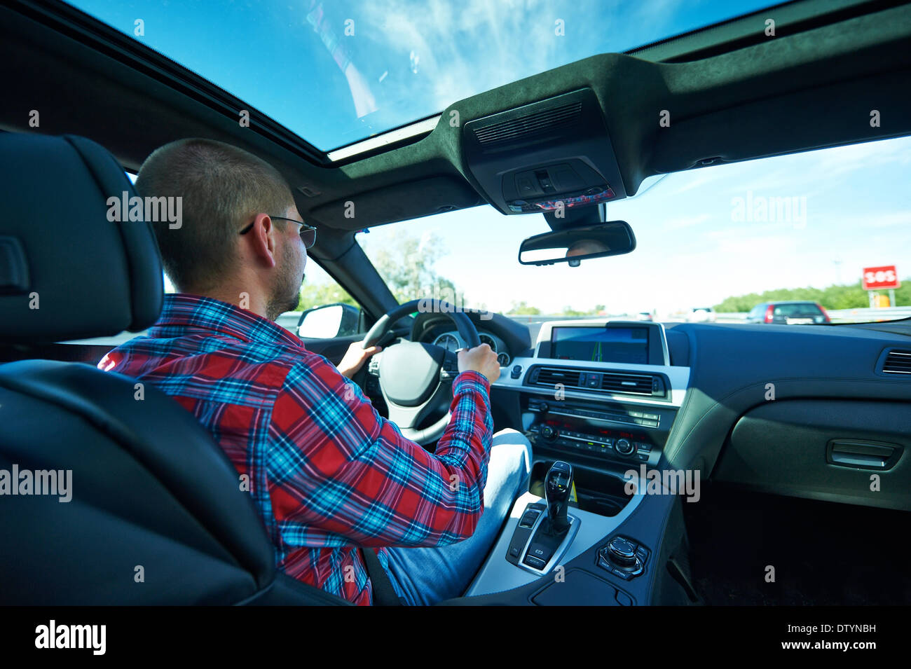 Man driving luxury car Stock Photo - Alamy