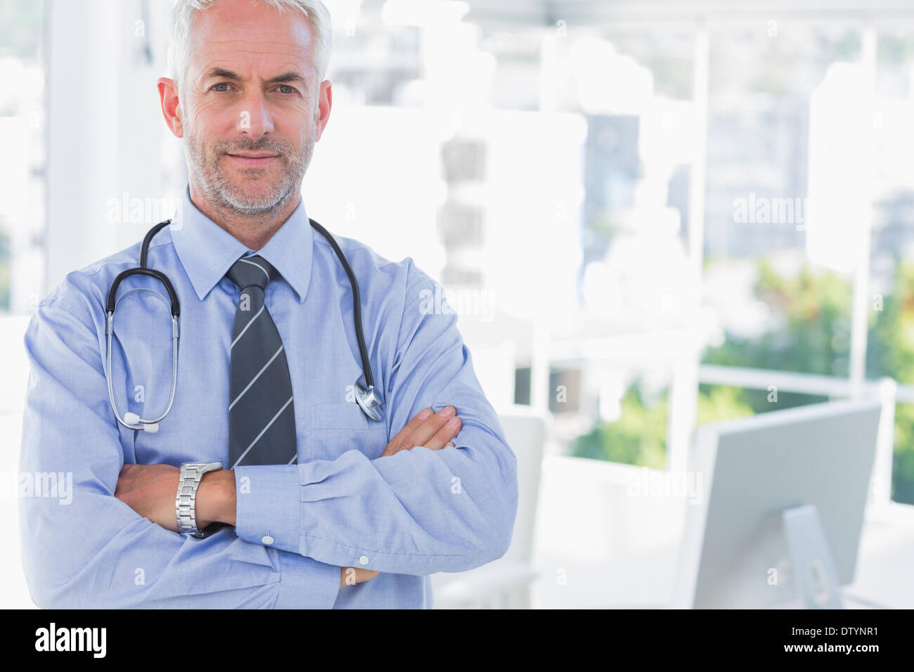 Doctor with arms crossed Stock Photo - Alamy
