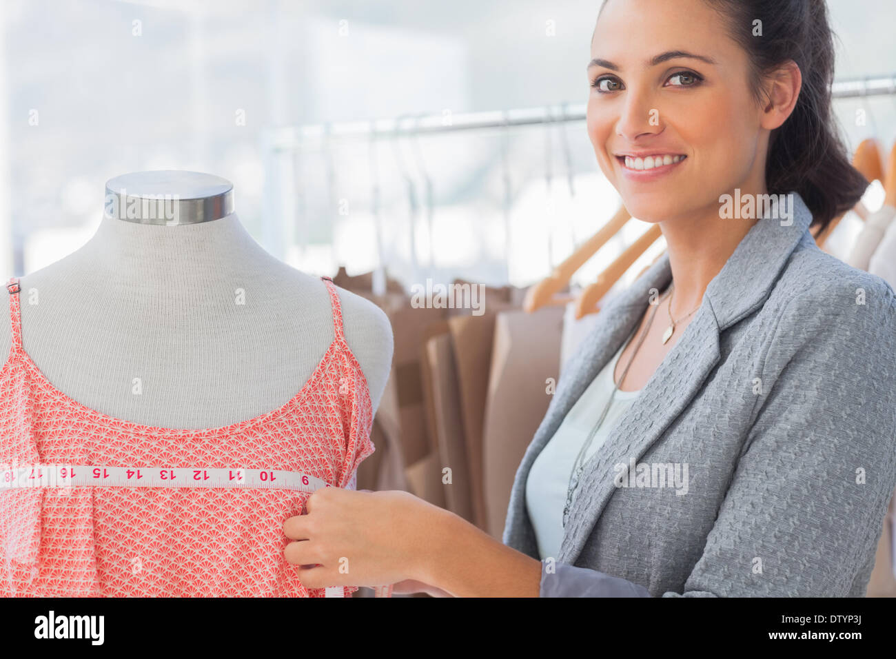 Pretty fashion designer measuring hi-res stock photography and images ...