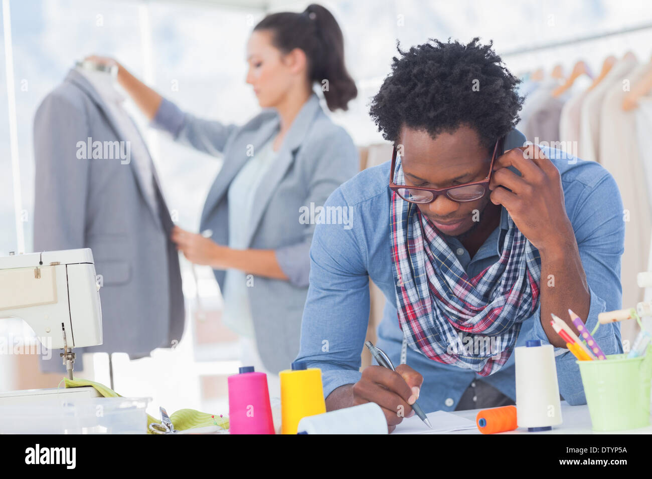 Fashion designer calling Stock Photo - Alamy