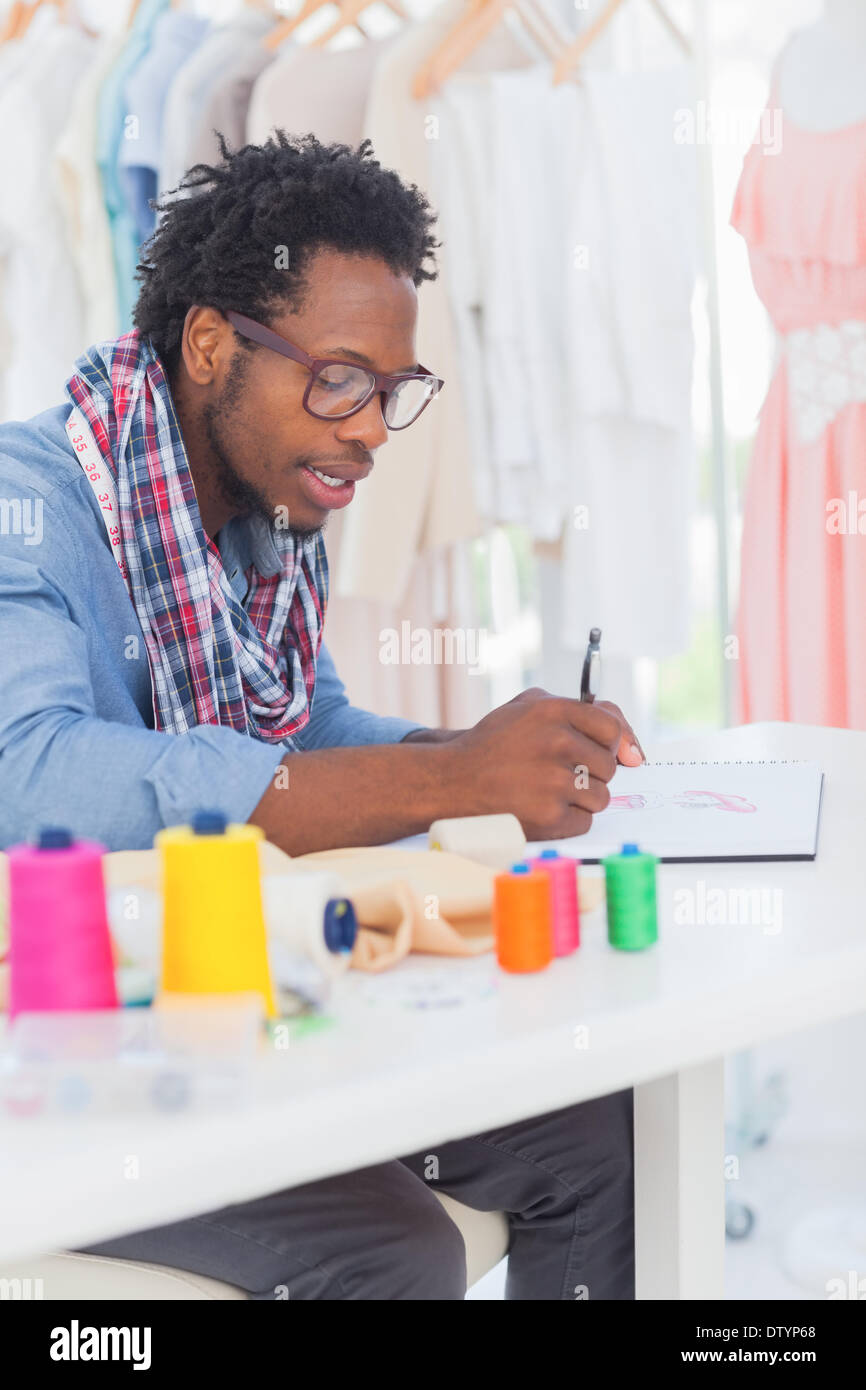 Fashion designer sketching Stock Photo - Alamy