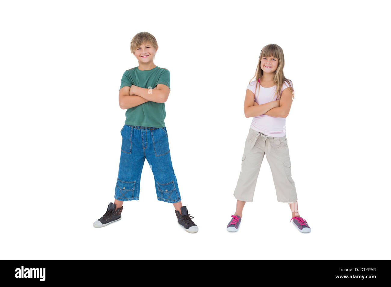 Smiling children with their arms crossed Stock Photo - Alamy