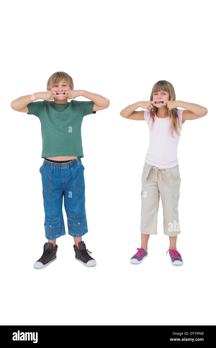 Funny children pulling faces Stock Photo - Alamy