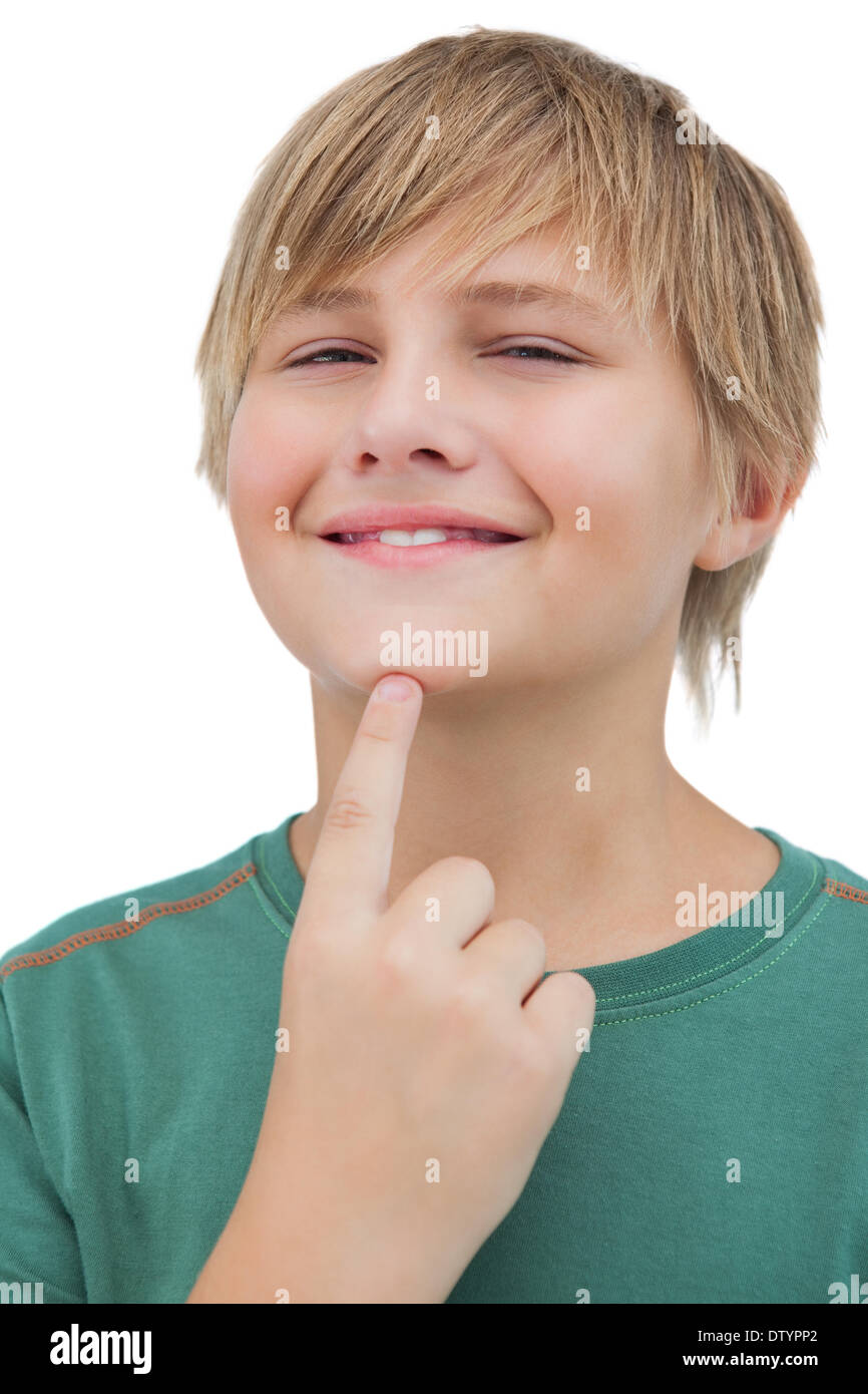 Smiling boy thinking Stock Photo - Alamy