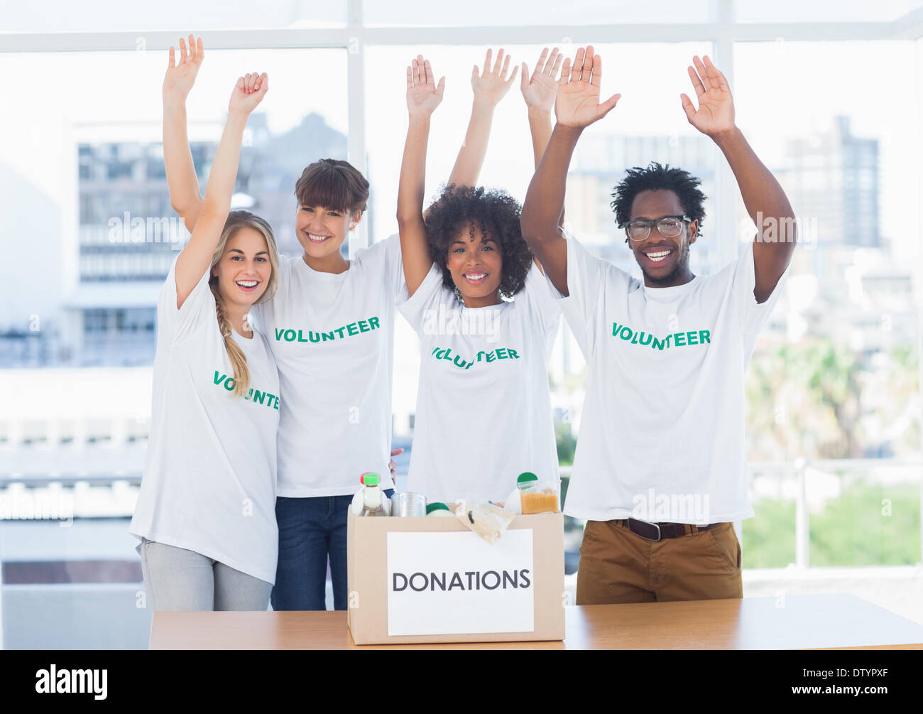 Volunteers raising their arms Stock Photo - Alamy