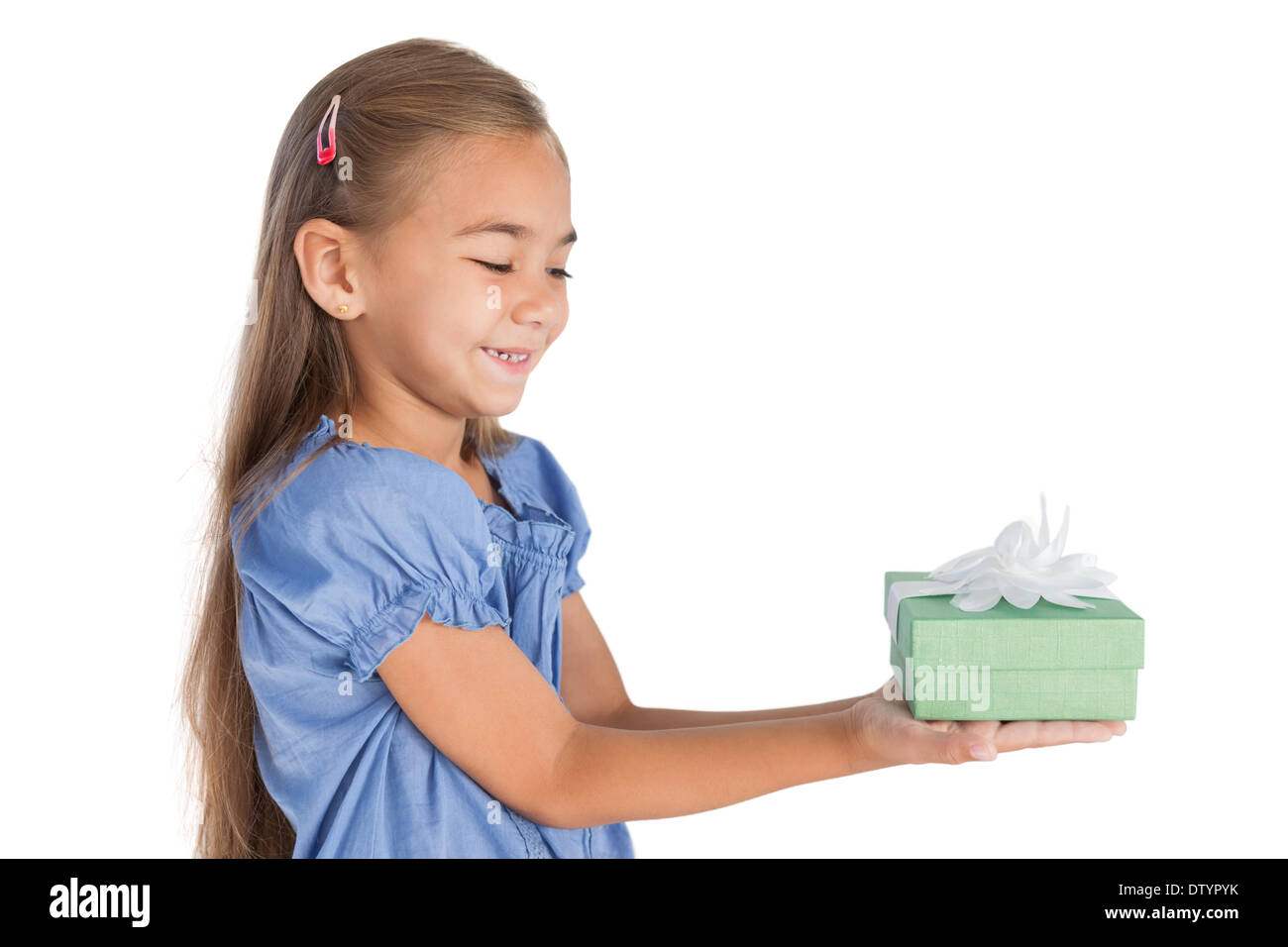 Blonde little girl giving a present Stock Photo - Alamy