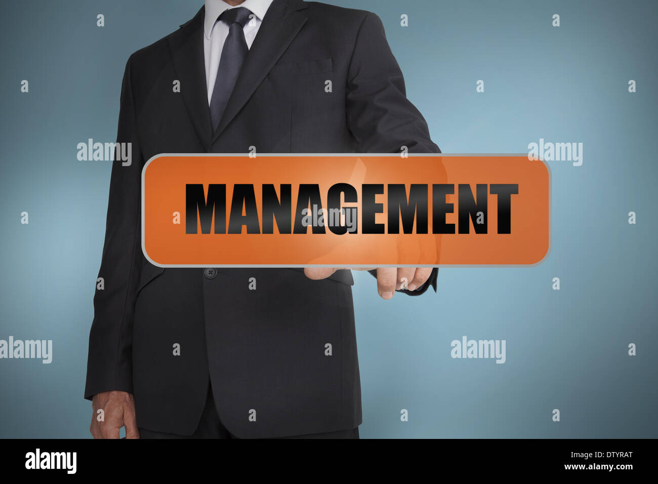Businessman touching the word management Stock Photo - Alamy