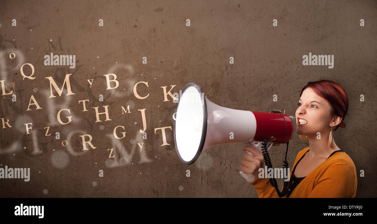 Young girl shouting into megaphone and text come out Stock Photo - Alamy