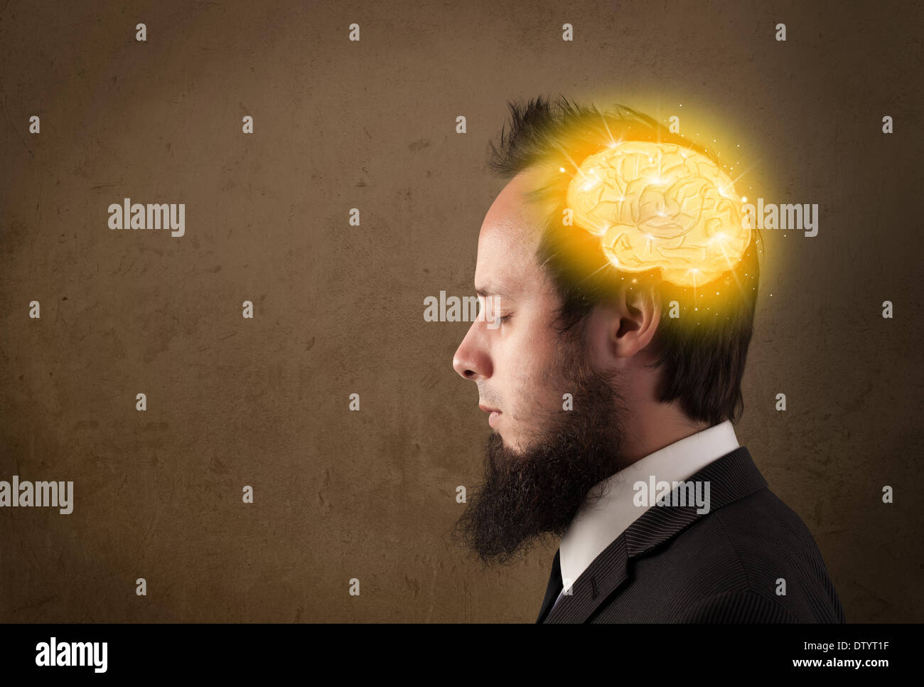 Young man thinking with glowing brain illustration Stock Photo - Alamy