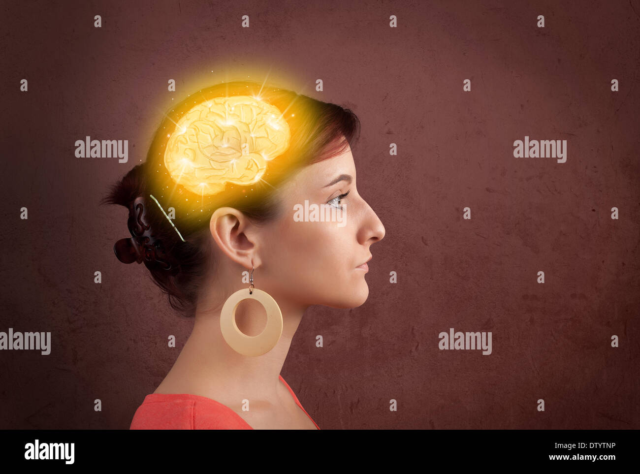 Young girl thinking with glowing brain illustration Stock Photo - Alamy