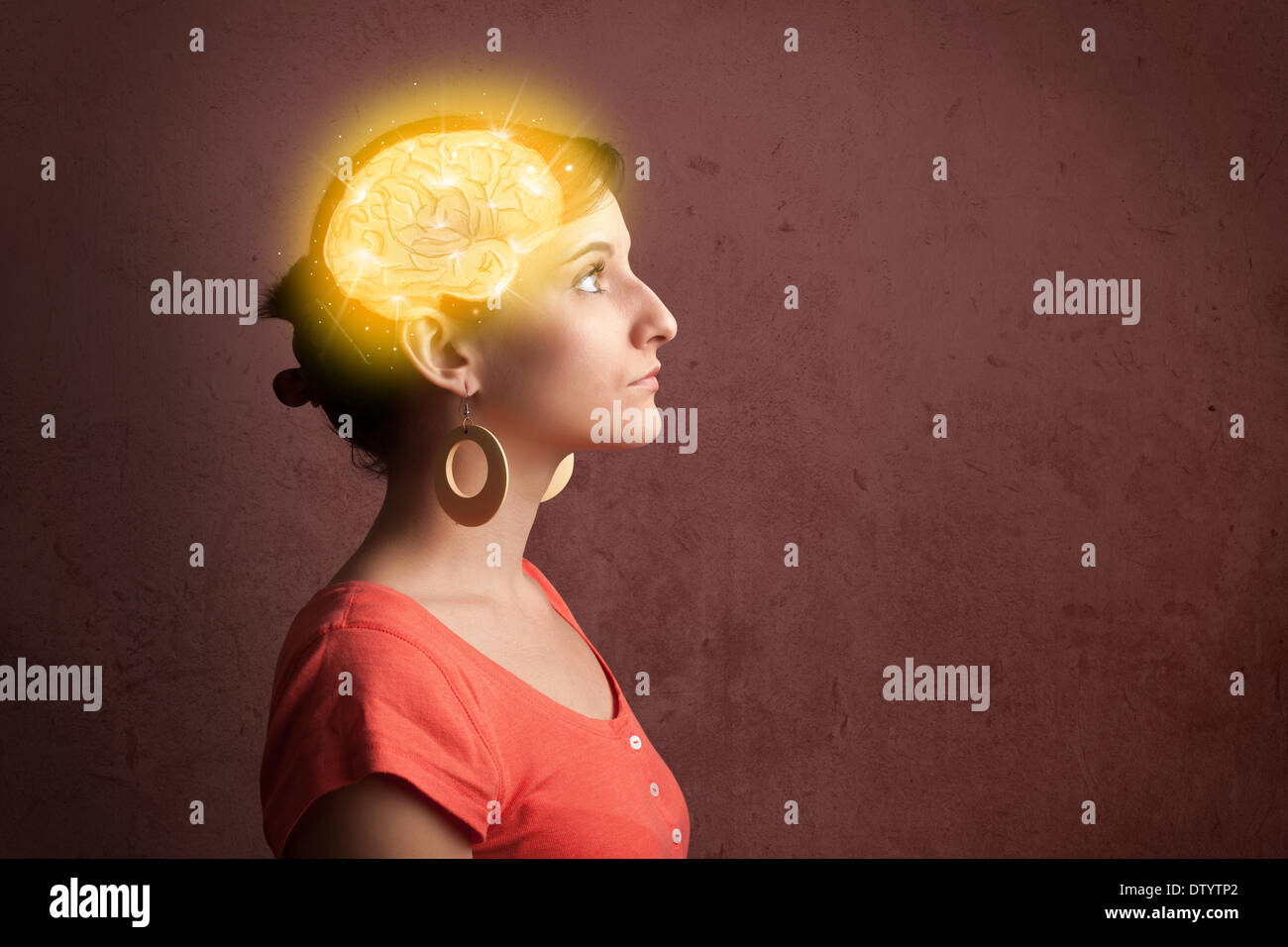 Young girl thinking with glowing brain illustration Stock Photo - Alamy
