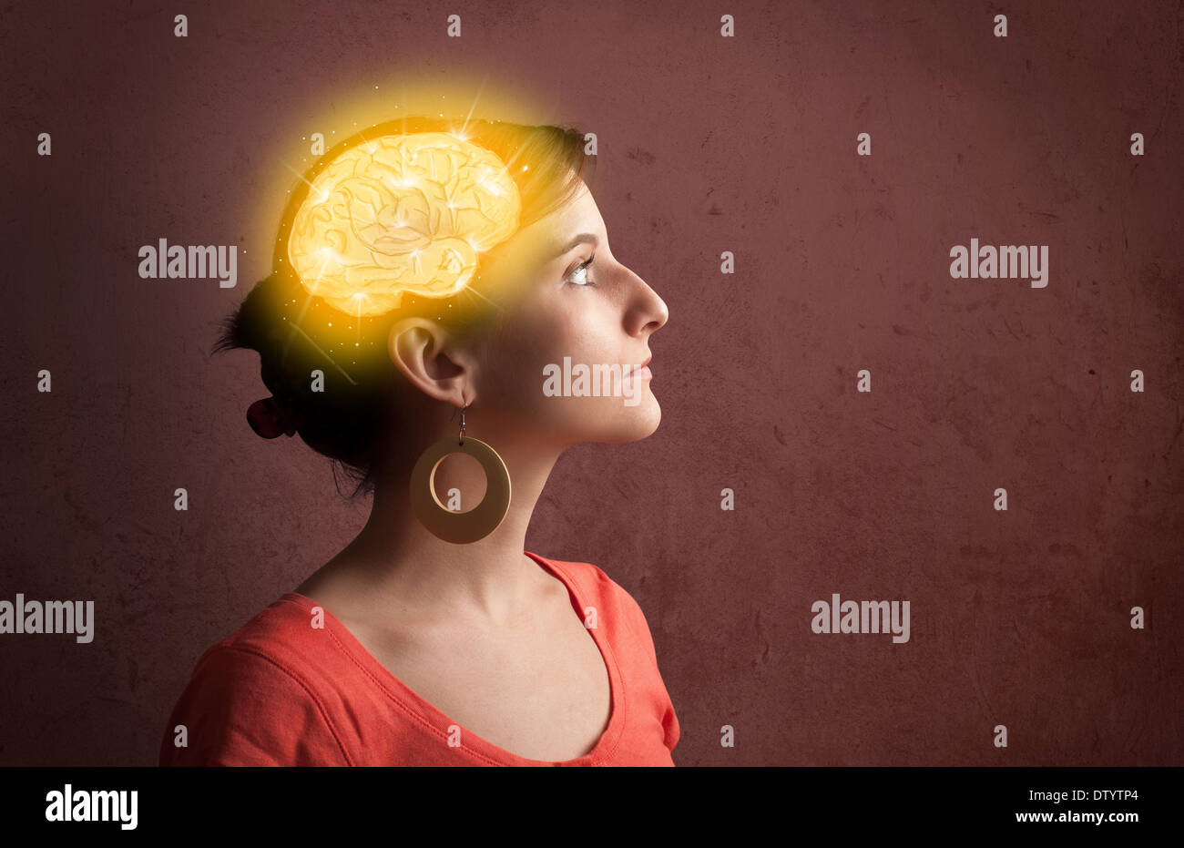 Young girl thinking with glowing brain illustration Stock Photo - Alamy