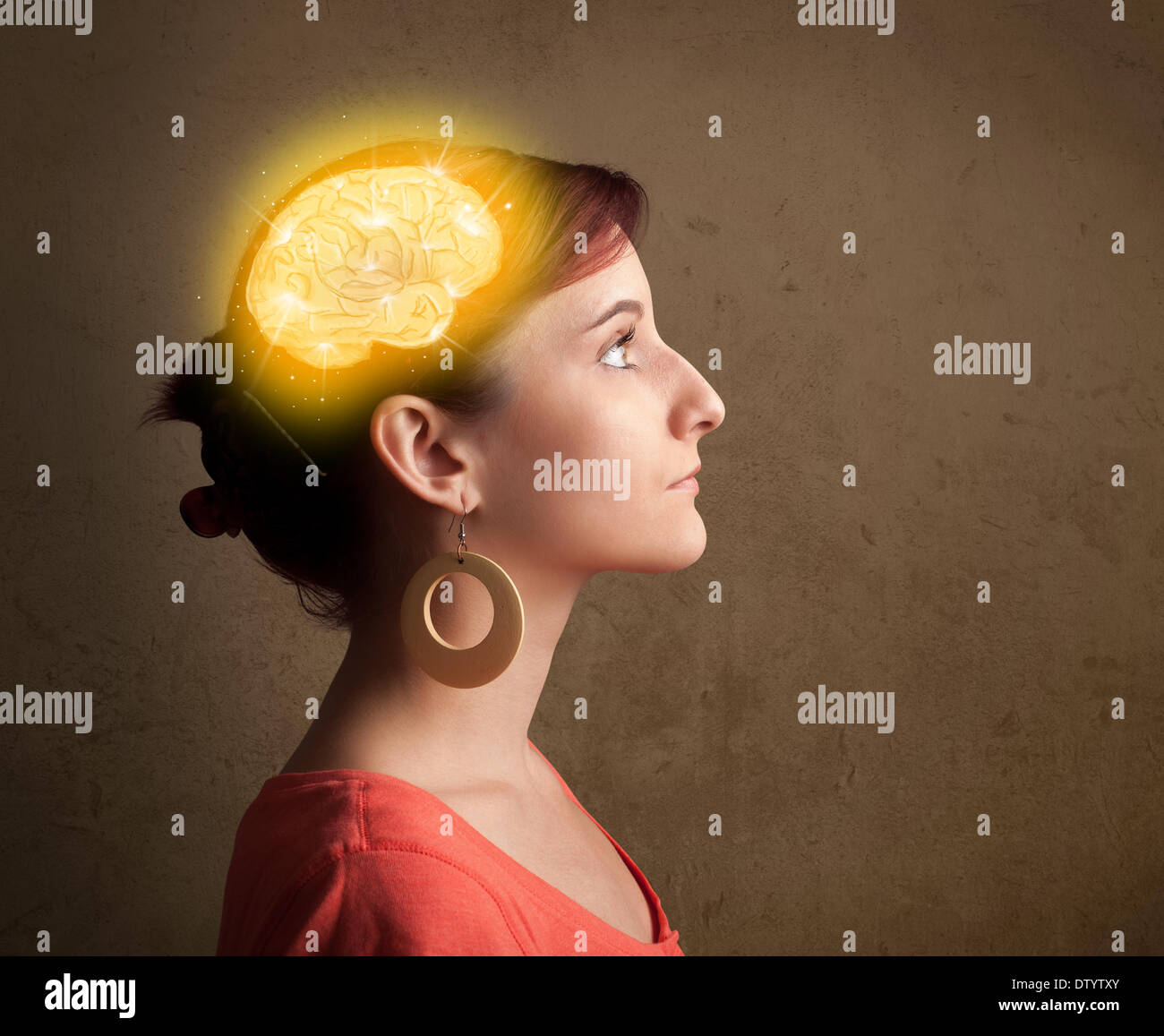 Young girl thinking with glowing brain illustration Stock Photo - Alamy