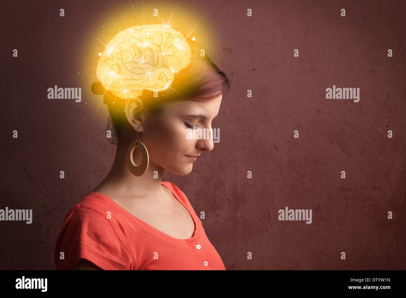Young girl thinking with glowing brain illustration Stock Photo - Alamy