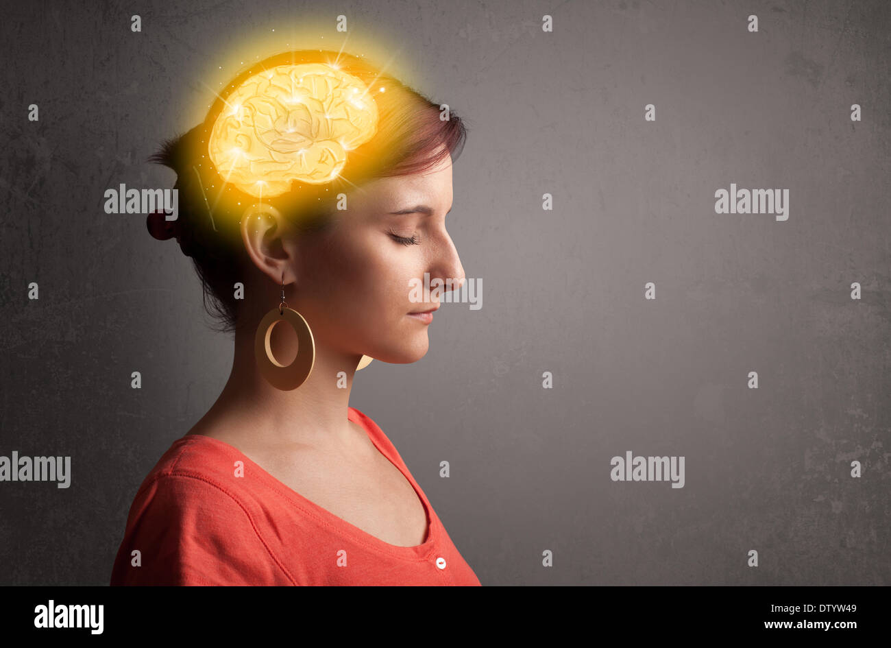Young girl thinking with glowing brain illustration Stock Photo - Alamy
