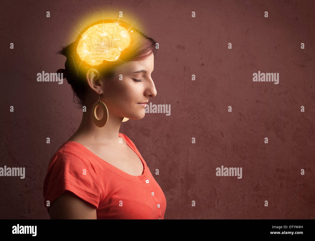 Young girl thinking with glowing brain illustration Stock Photo - Alamy