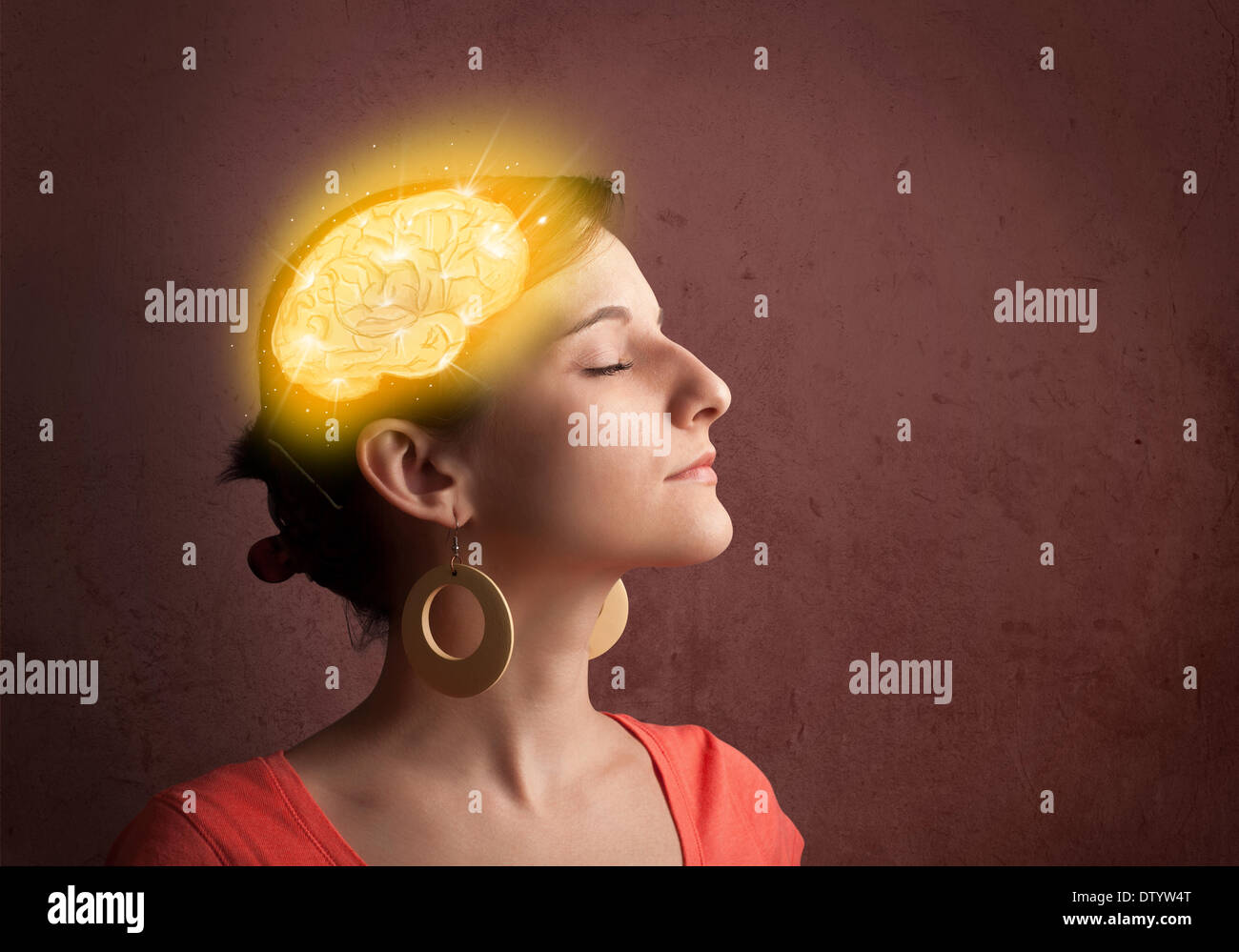 Young girl thinking with glowing brain illustration Stock Photo - Alamy