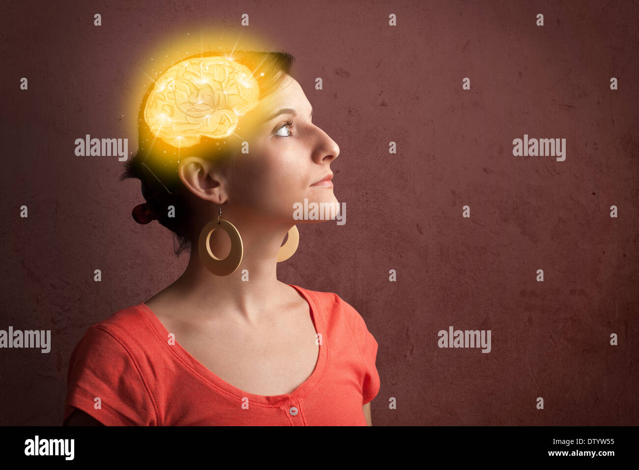 Young girl thinking with glowing brain illustration Stock Photo - Alamy