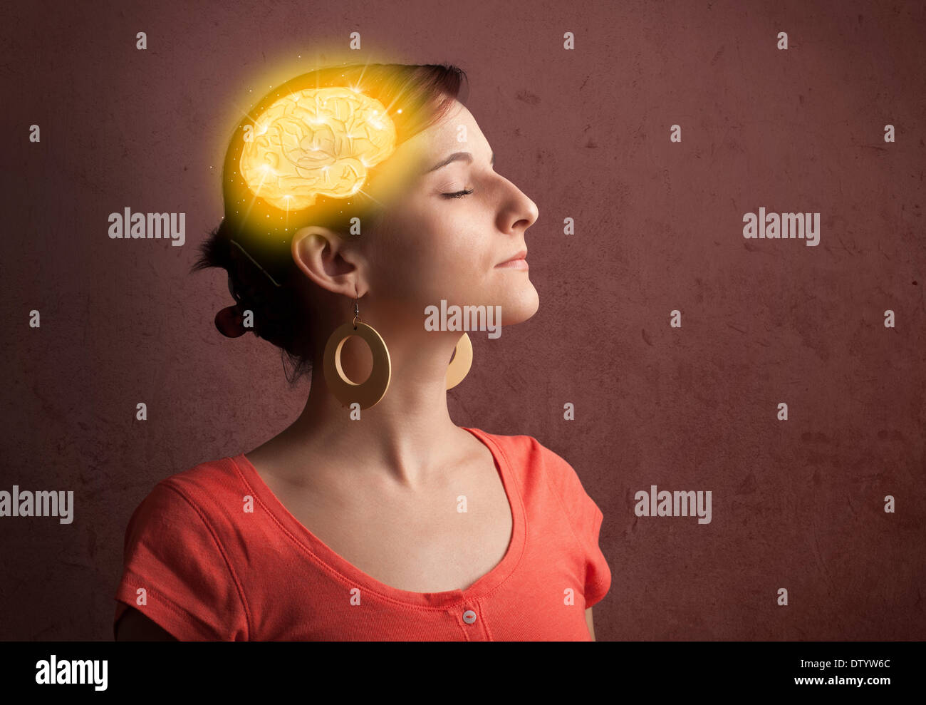 Young girl thinking with glowing brain illustration Stock Photo - Alamy