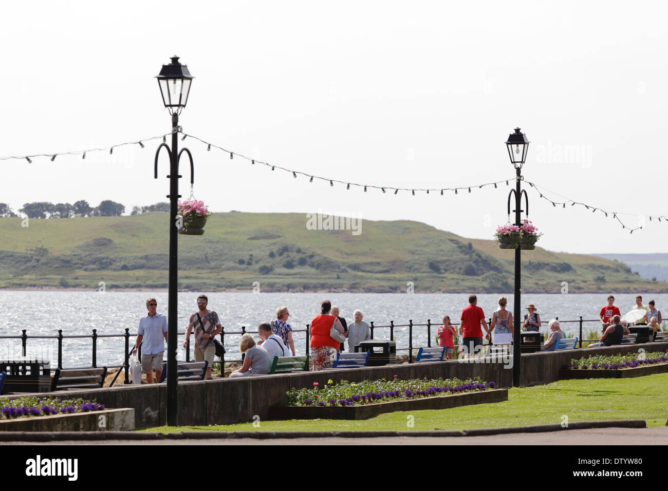 People walking on Largs Promenade by the Firth of Clyde in Summer ...