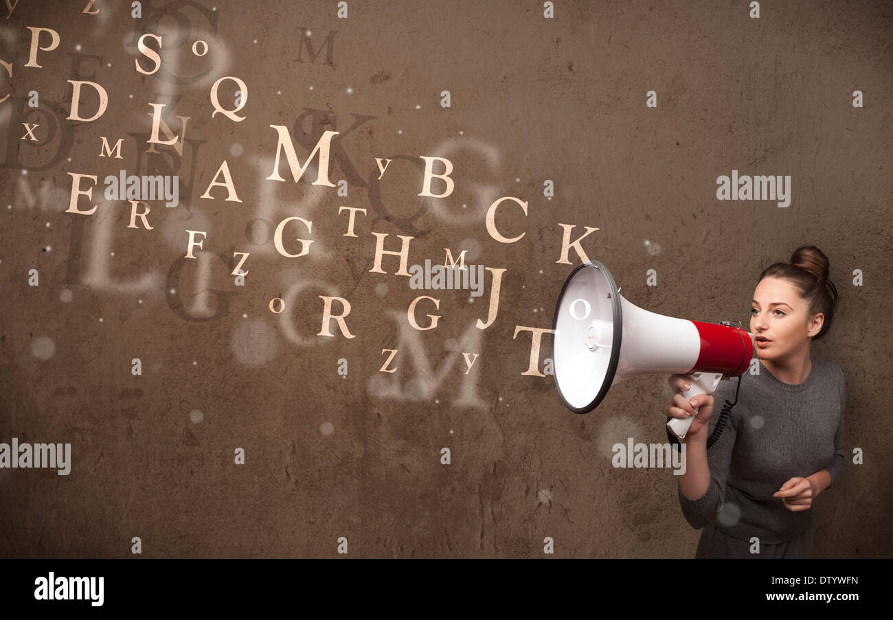 Young girl shouting into megaphone and text come out Stock Photo - Alamy