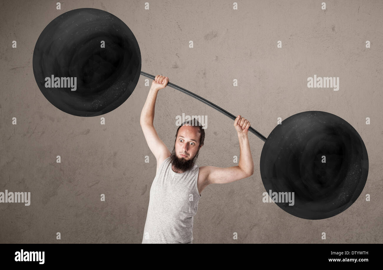 Funny skinny guy lifting weights Stock Photo - Alamy