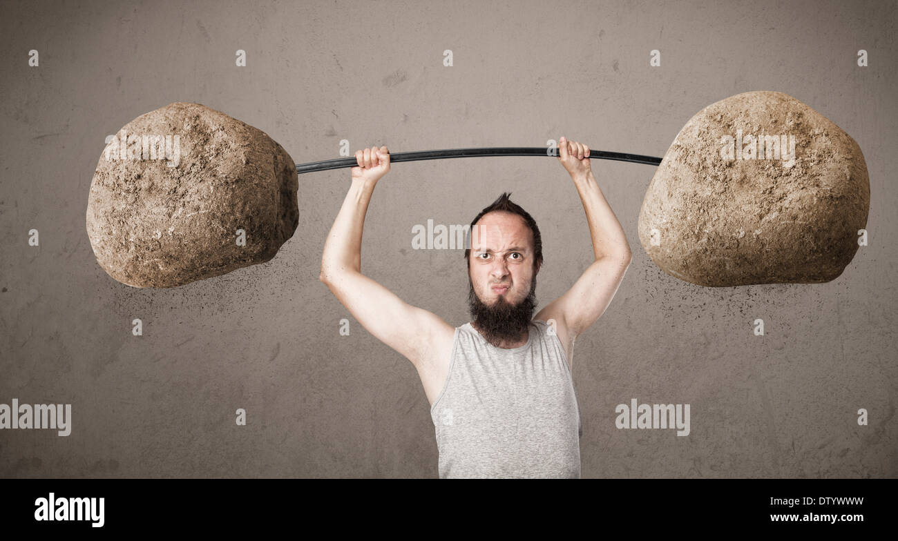 Skinny guy lifting large rock hi-res stock photography and images - Alamy