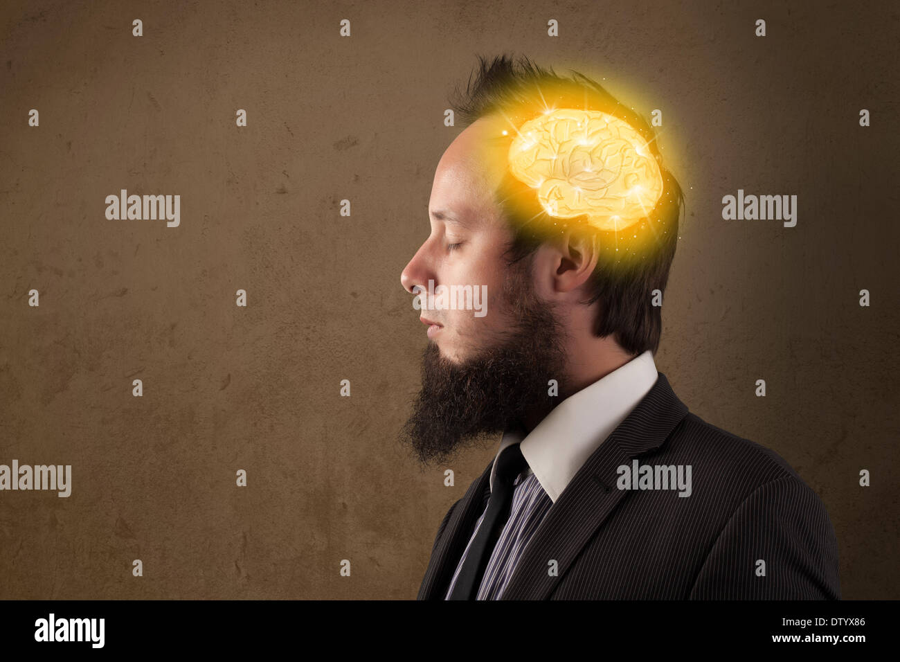 Young man thinking with glowing brain illustration Stock Photo - Alamy