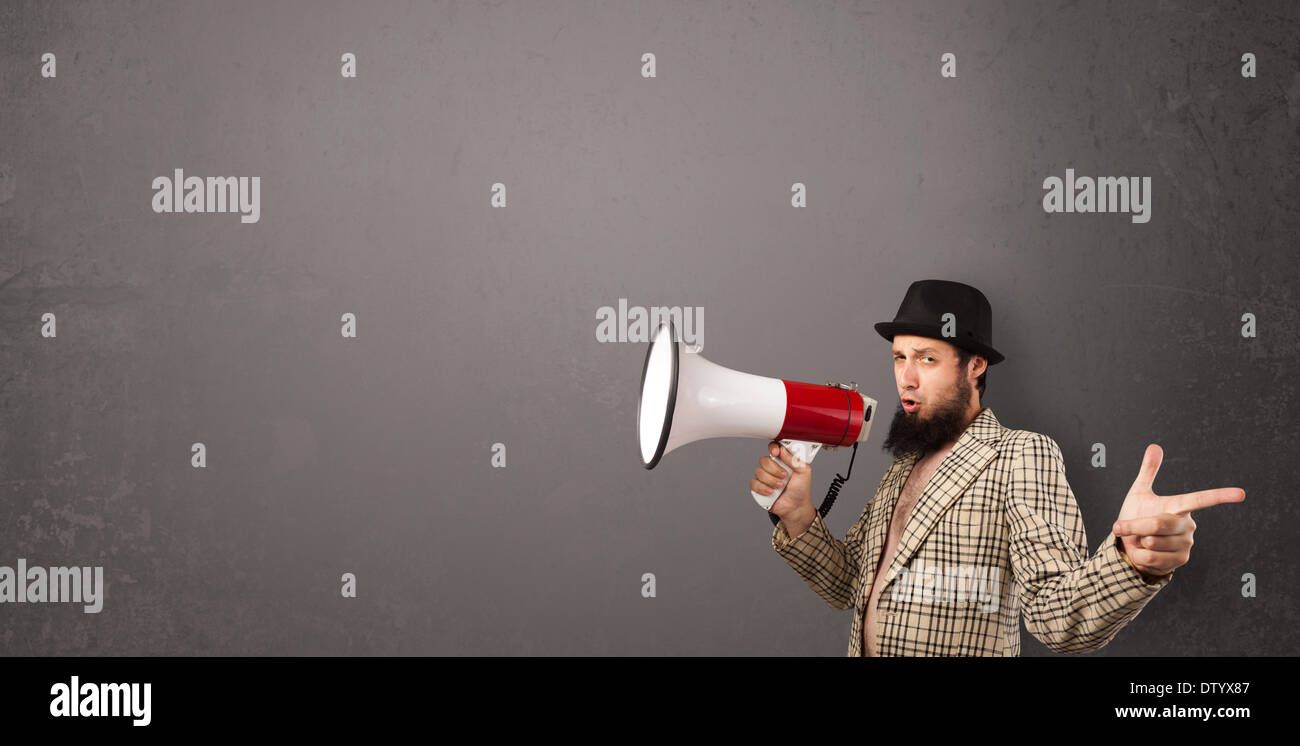 Guy shouting into megaphone on copy space background Stock Photo - Alamy