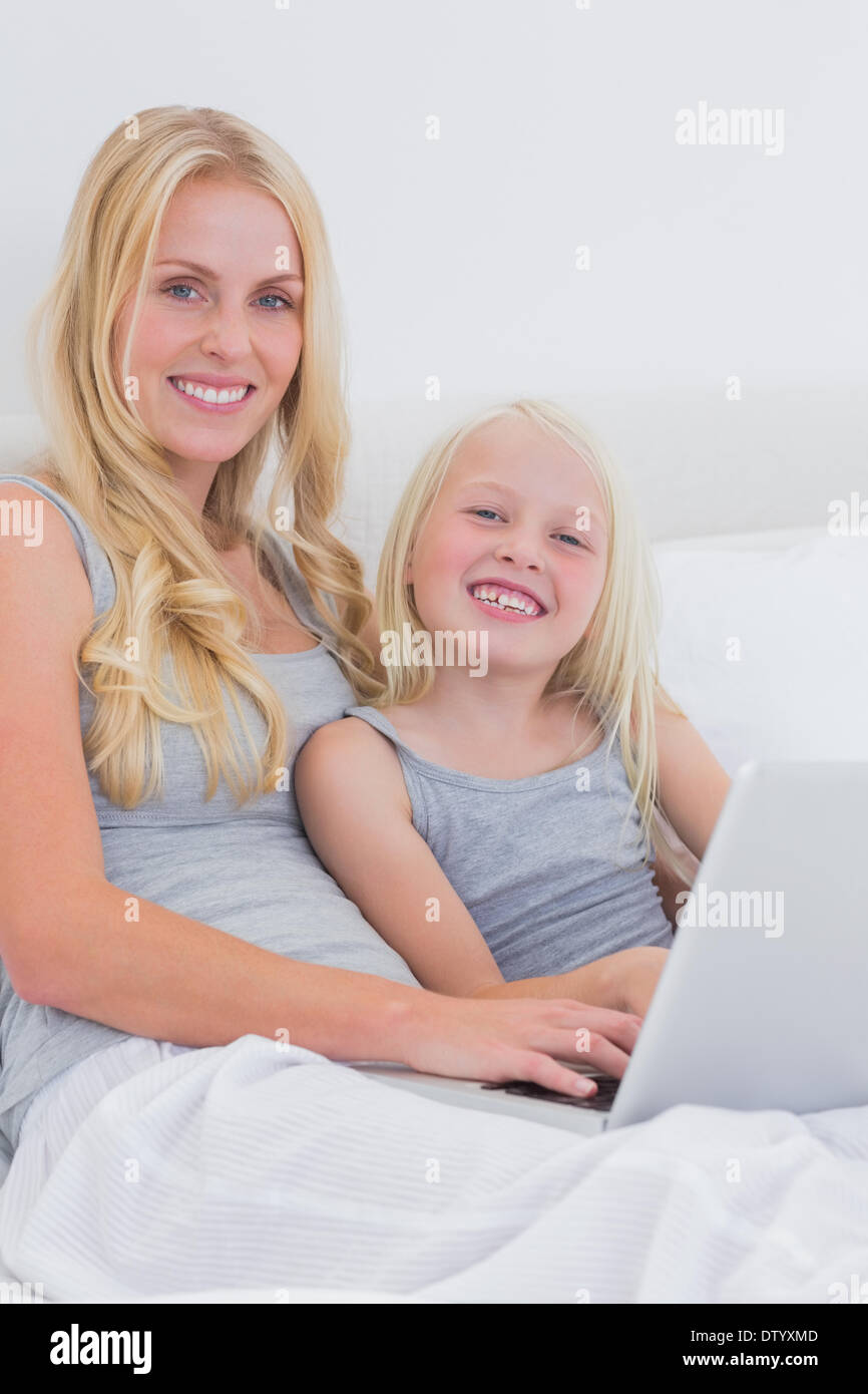 Mother and daughter using a laptop Stock Photo - Alamy