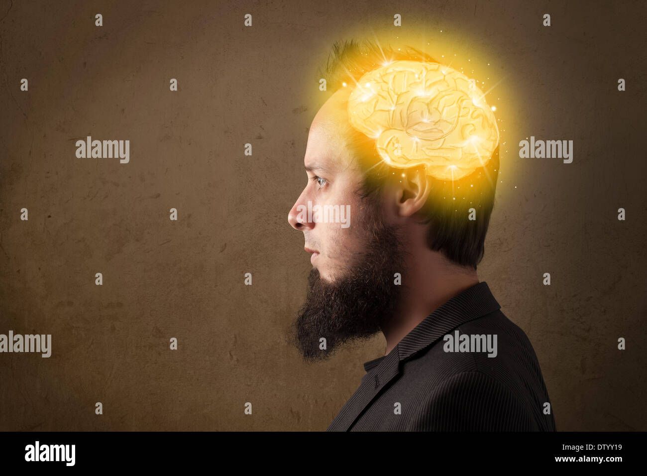 Young man thinking with glowing brain illustration Stock Photo - Alamy