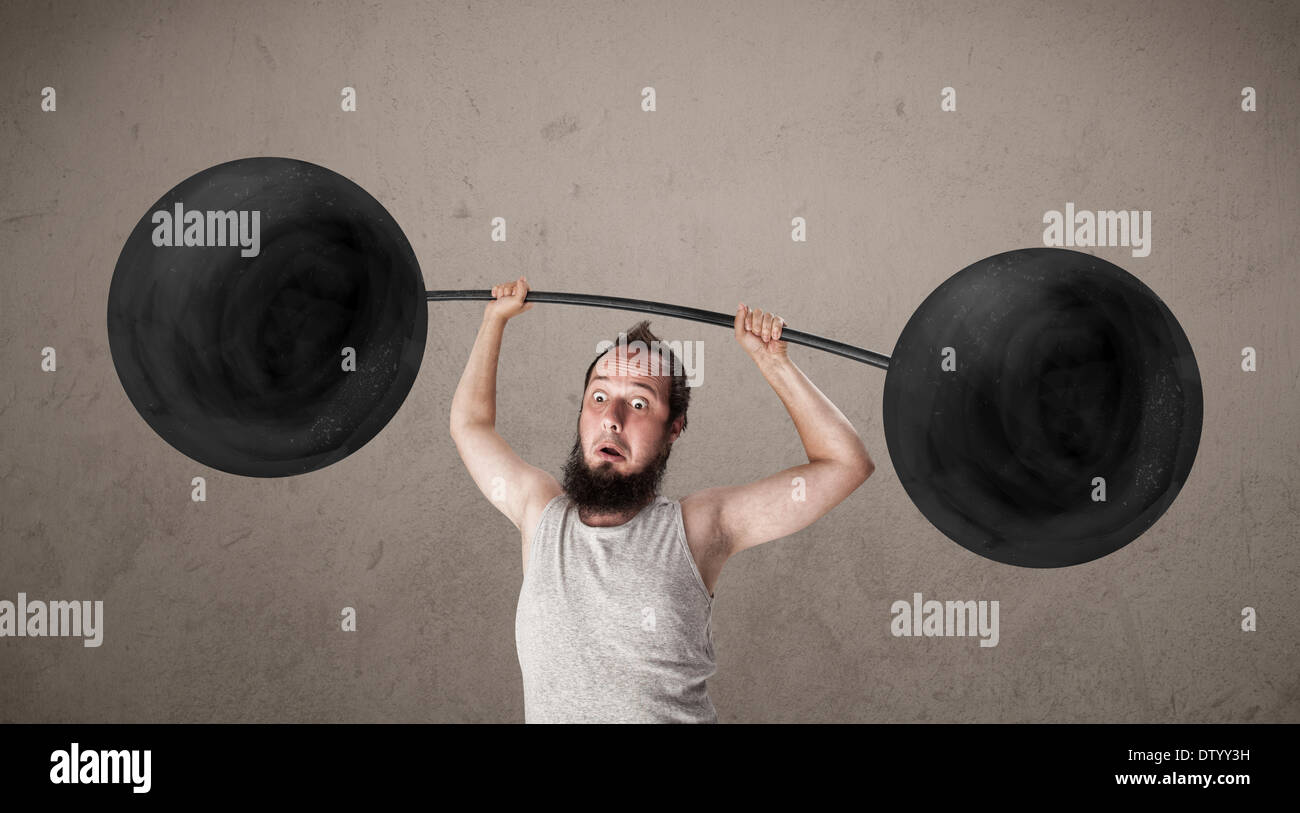 Funny skinny guy lifting weights Stock Photo - Alamy