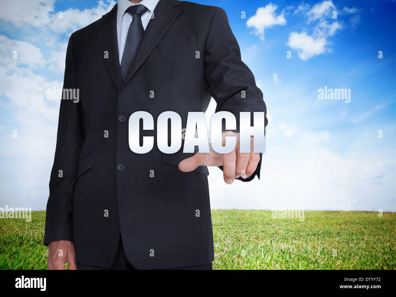 Businessman selecting coach word Stock Photo - Alamy