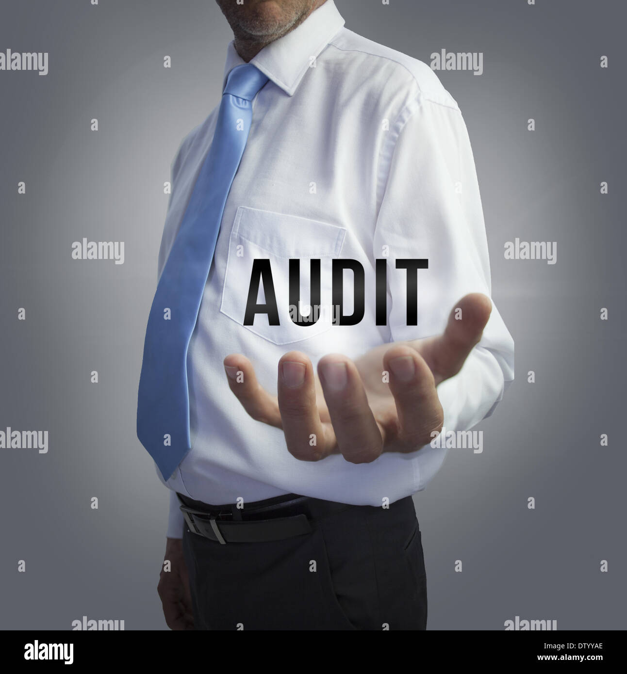 Businessman holding the word audit Stock Photo - Alamy