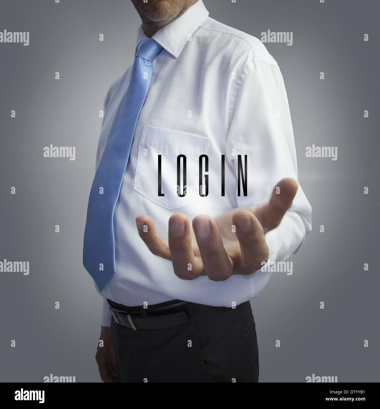 Businessman holding the word login Stock Photo - Alamy