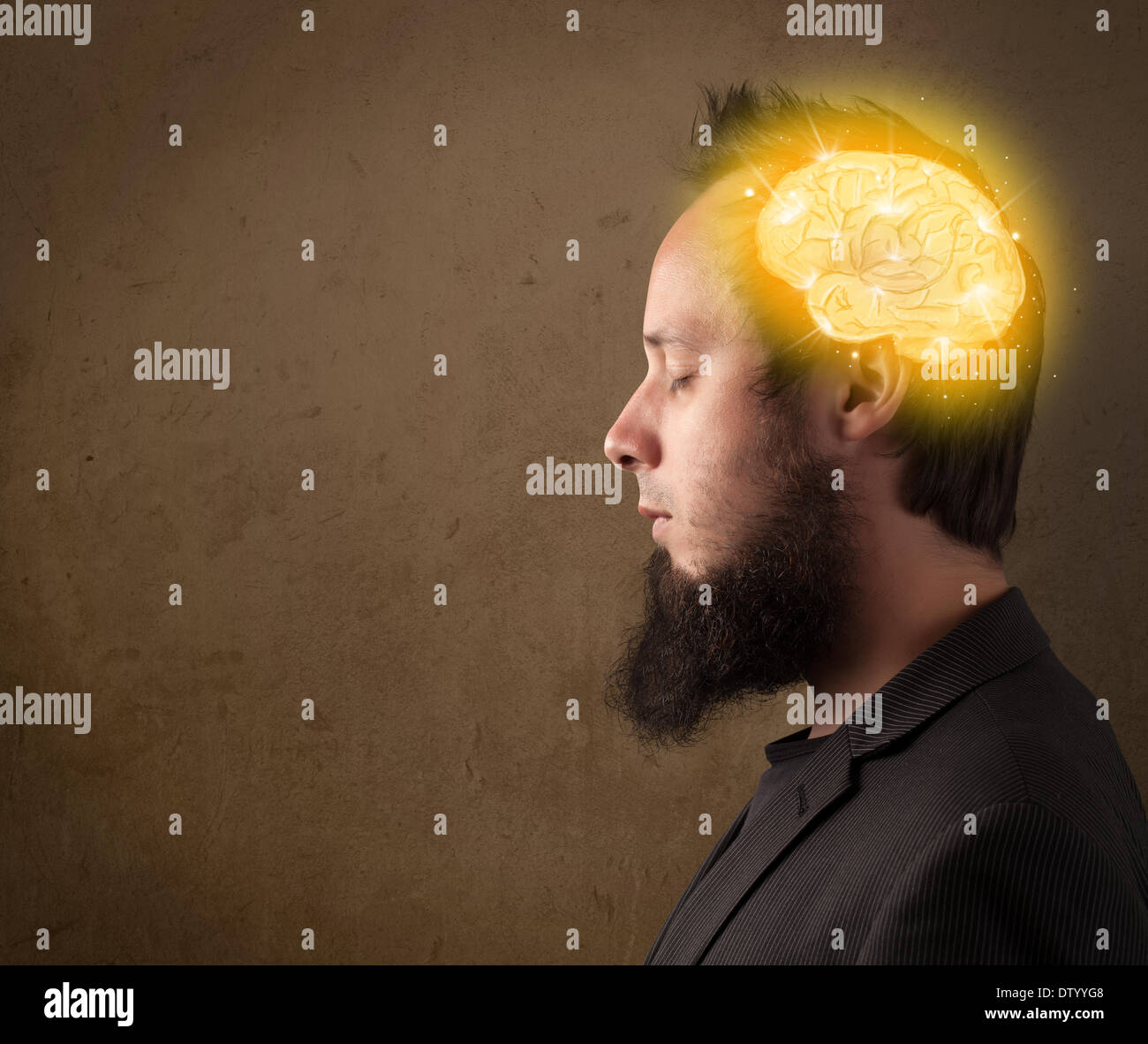 Young man thinking with glowing brain illustration Stock Photo - Alamy