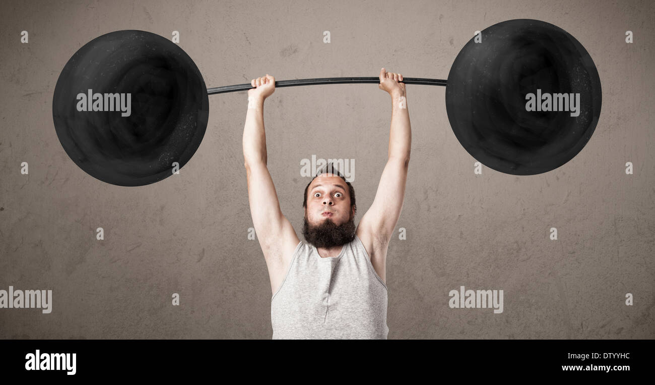 Funny skinny guy lifting weights Stock Photo - Alamy
