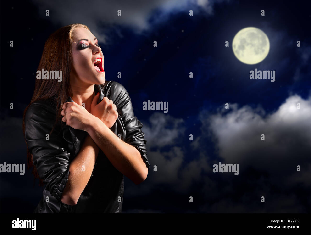 Vampire girl on night sky with moon Stock Photo - Alamy