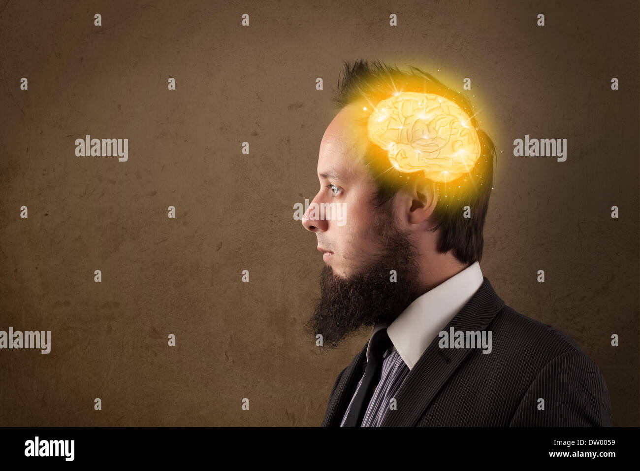 Young man thinking with glowing brain illustration Stock Photo - Alamy