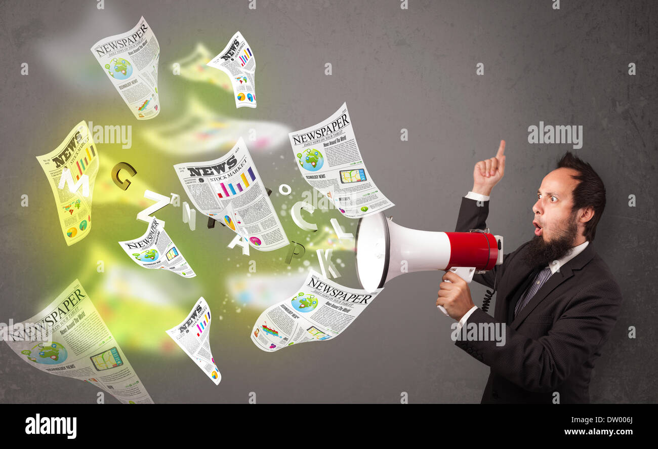 Guy yelling into loudspeaker and newspapers fly out Stock Photo - Alamy