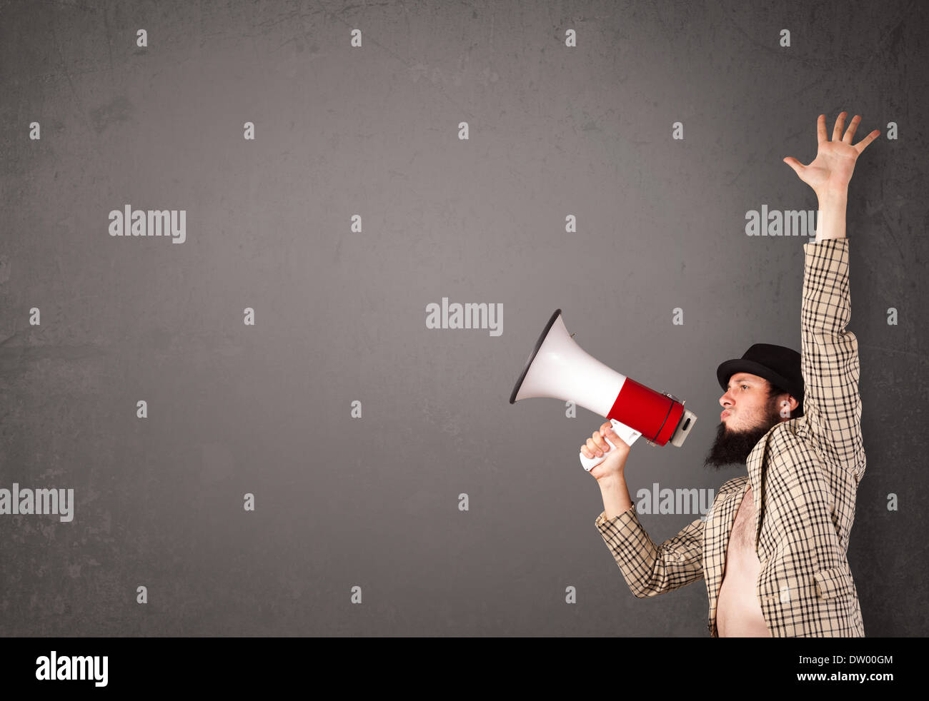 Guy shouting into megaphone on copy space background Stock Photo - Alamy