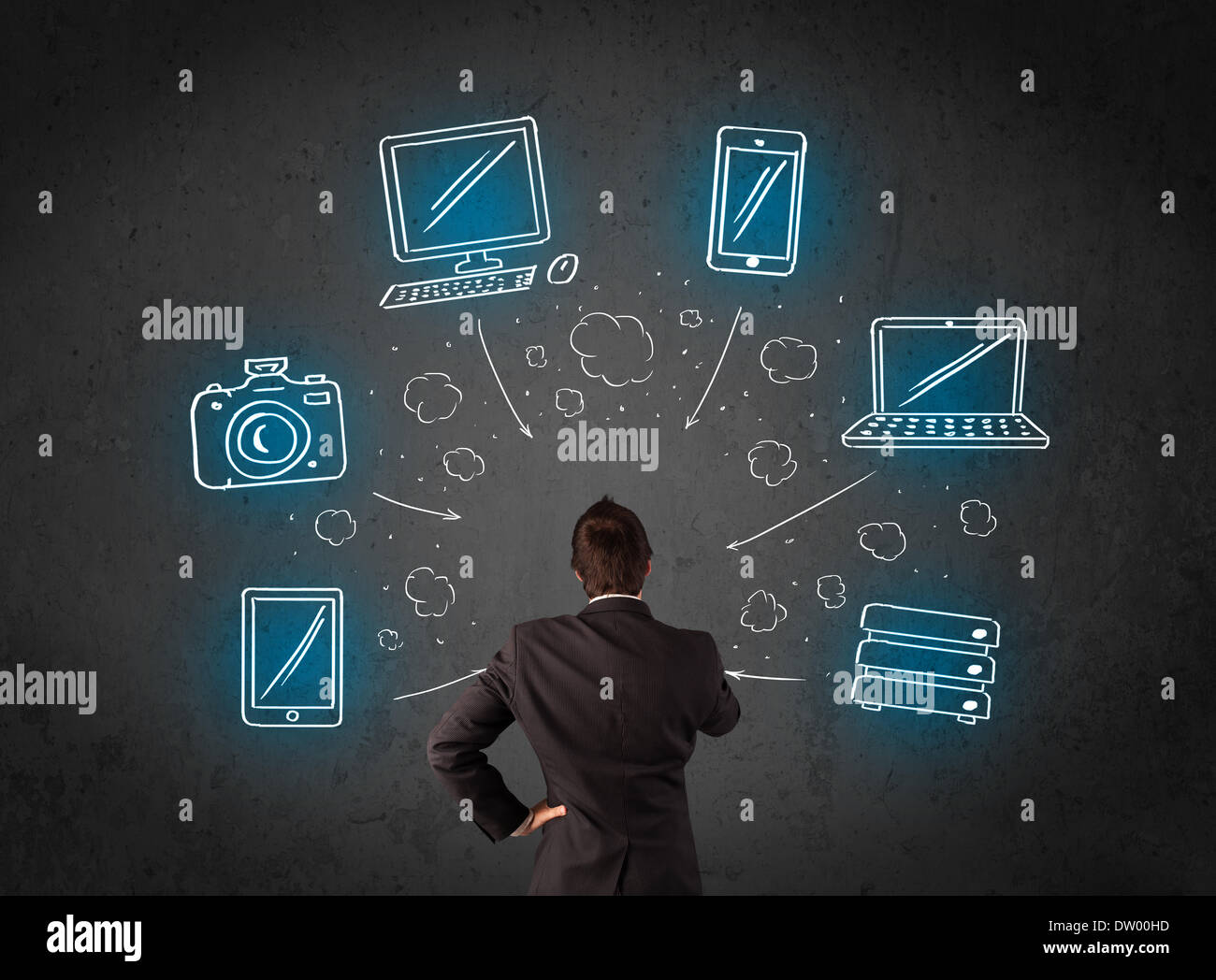 Businessman with multimedia icons over his head Stock Photo - Alamy